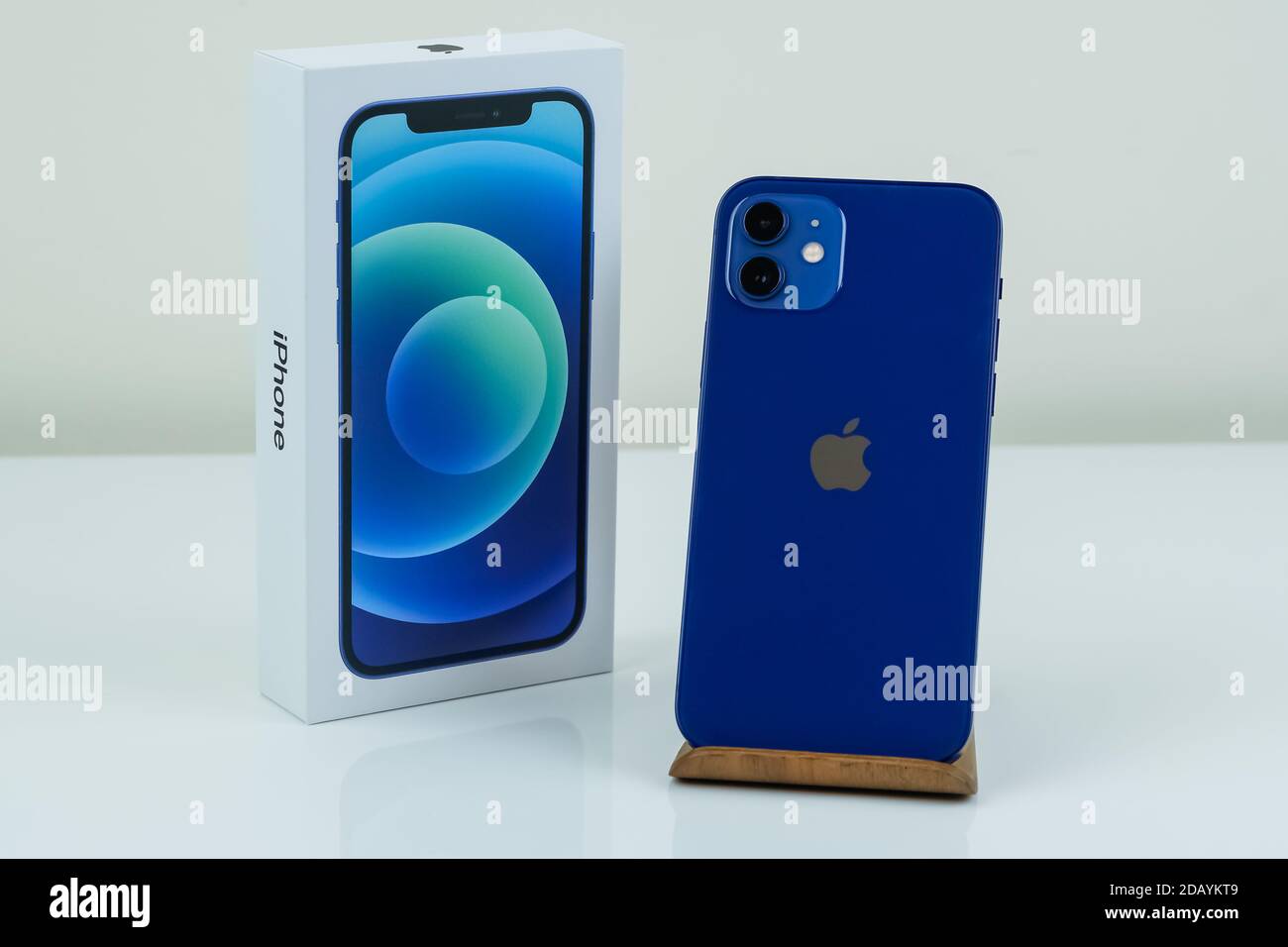 iPhone 12 in blue next to its box Stock Photo - Alamy