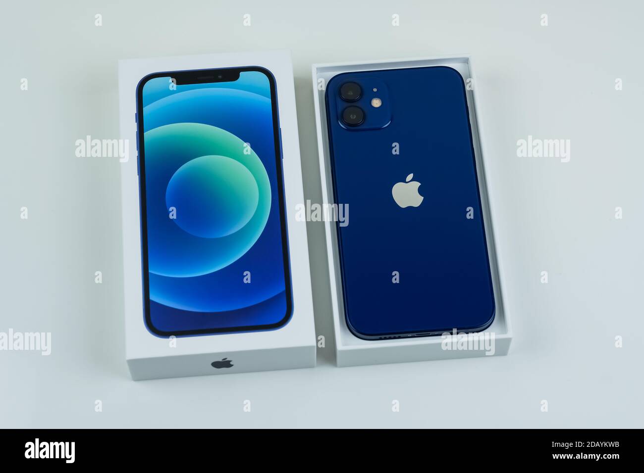 iPhone 12 in blue next to its box Stock Photo - Alamy