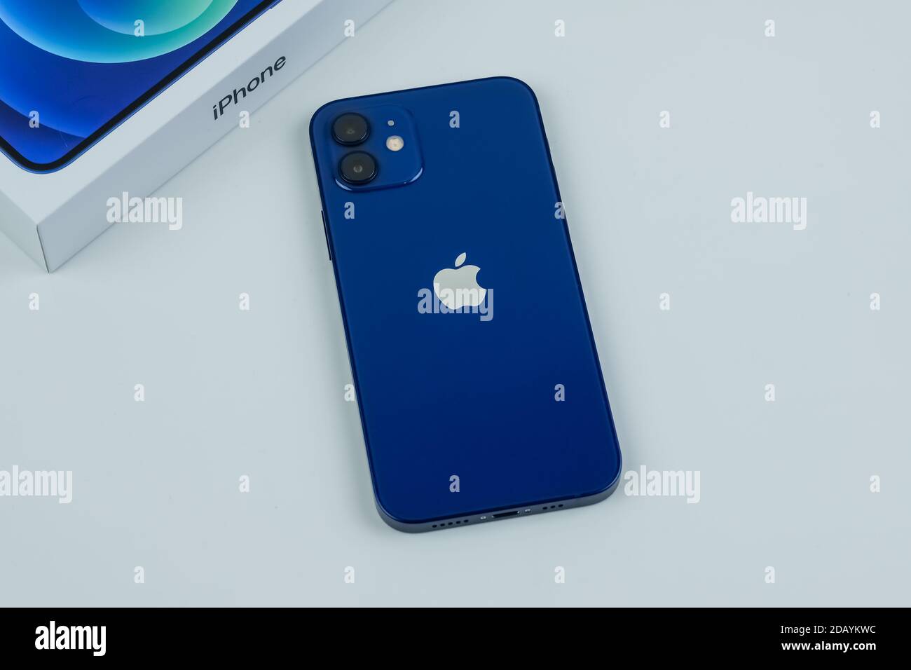 iPhone 12 in blue next to its box Stock Photo - Alamy