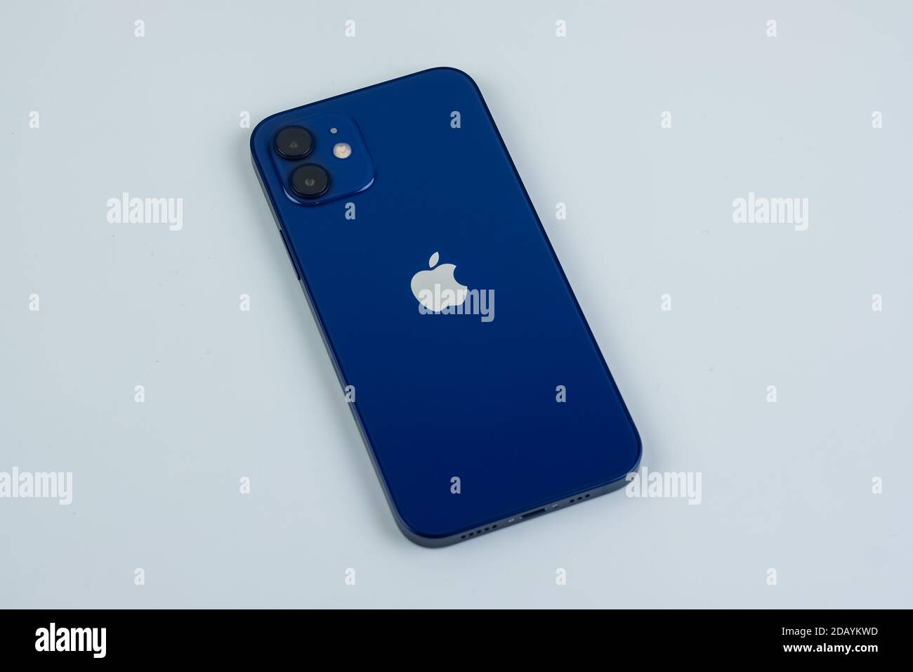 iPhone 12 in blue on a white desk Stock Photo - Alamy