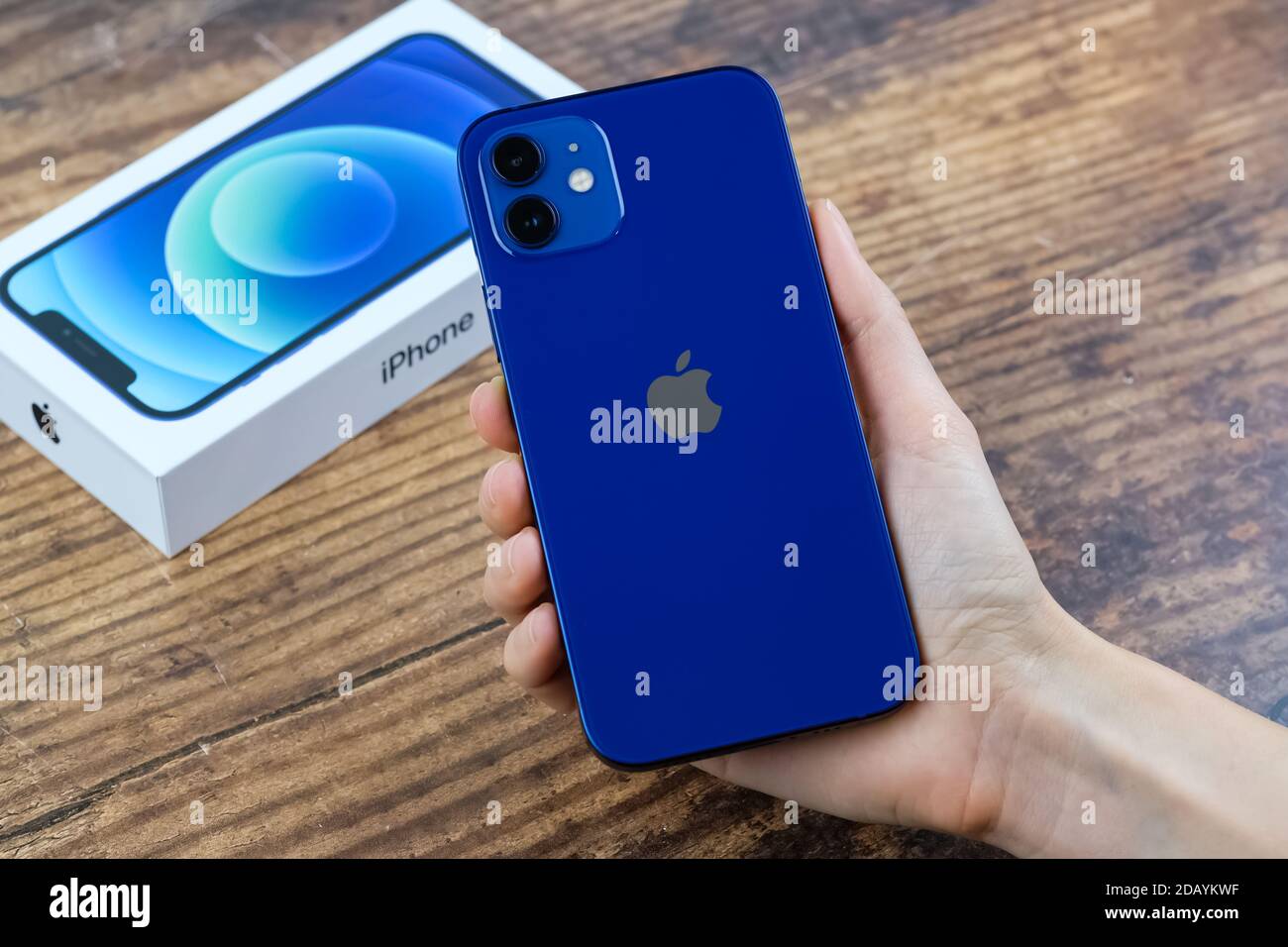 iPhone 12 in blue next to its box Stock Photo - Alamy