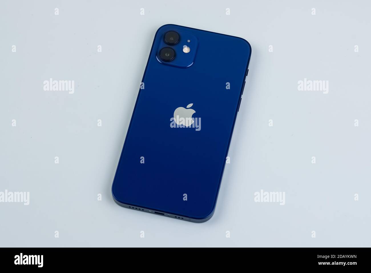 iPhone 12 in blue on a white desk Stock Photo - Alamy