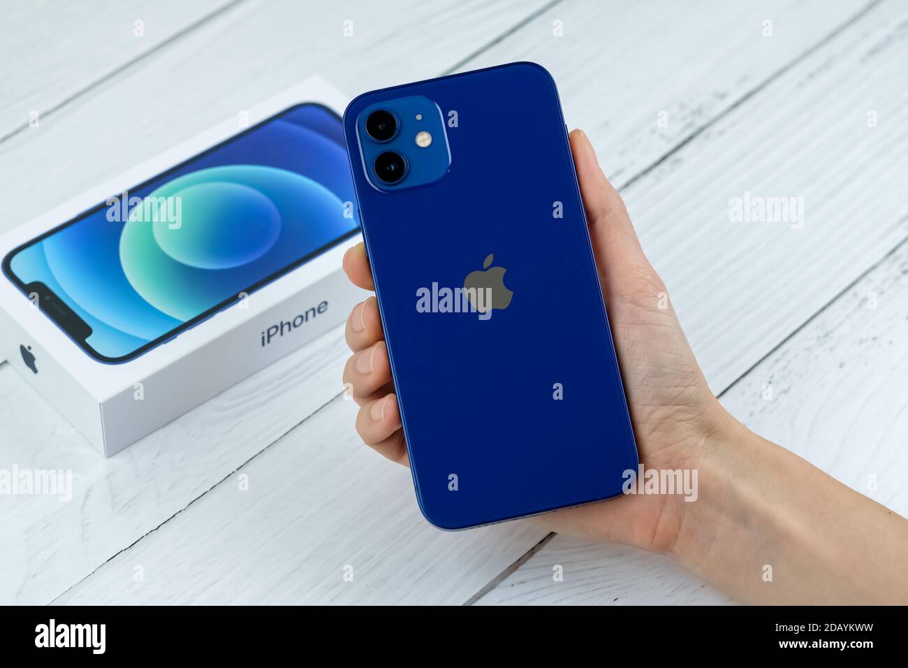 iPhone 12 in blue next to its box Stock Photo - Alamy