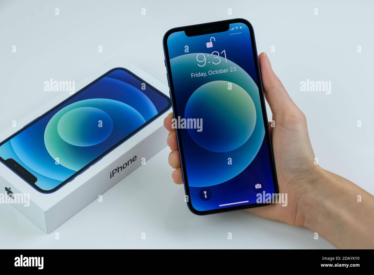 iPhone 12 in blue next to its box Stock Photo - Alamy