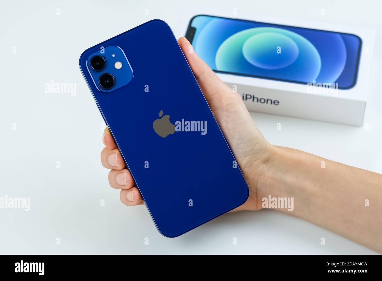 iPhone 12 in blue next to its box Stock Photo - Alamy