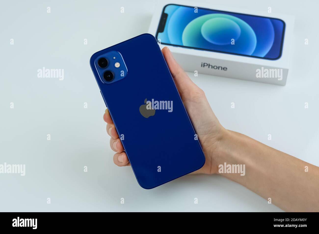 iPhone 12 in blue next to its box Stock Photo - Alamy