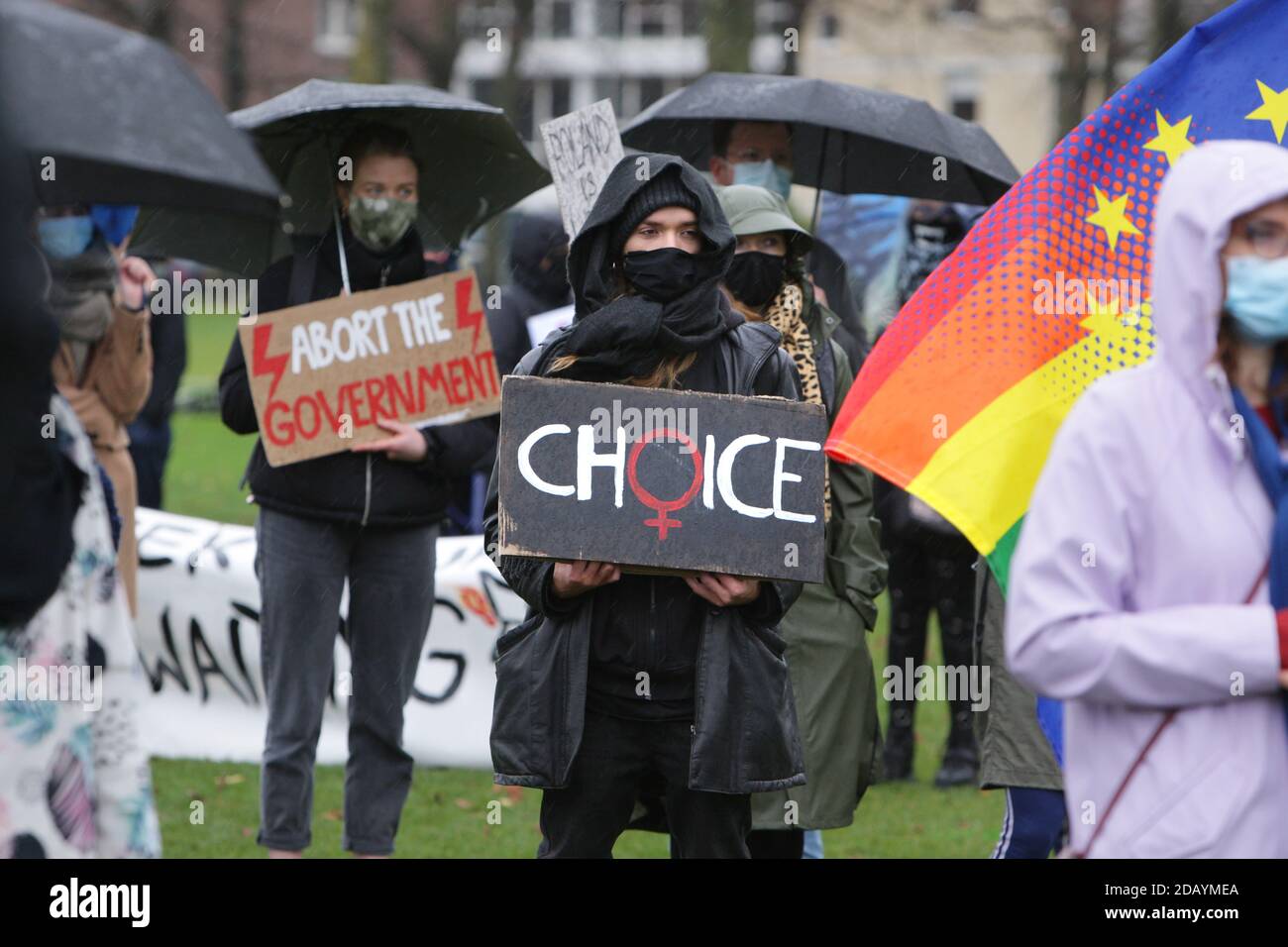 Pro-choice activists wearing protective face masks protest against the ...