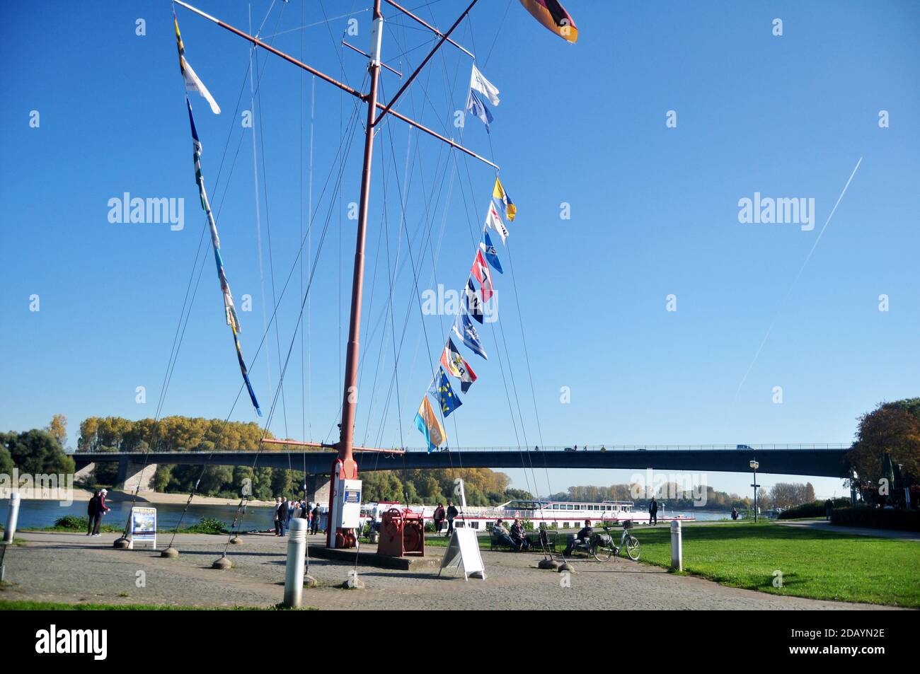 German people and foreign travelers walking relax footpath riverside ...