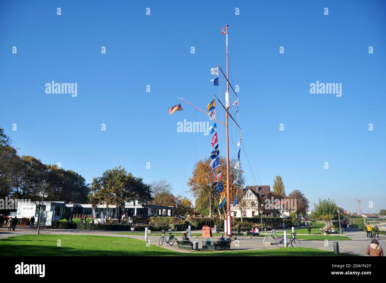 German people and foreign travelers walking relax footpath riverside ...