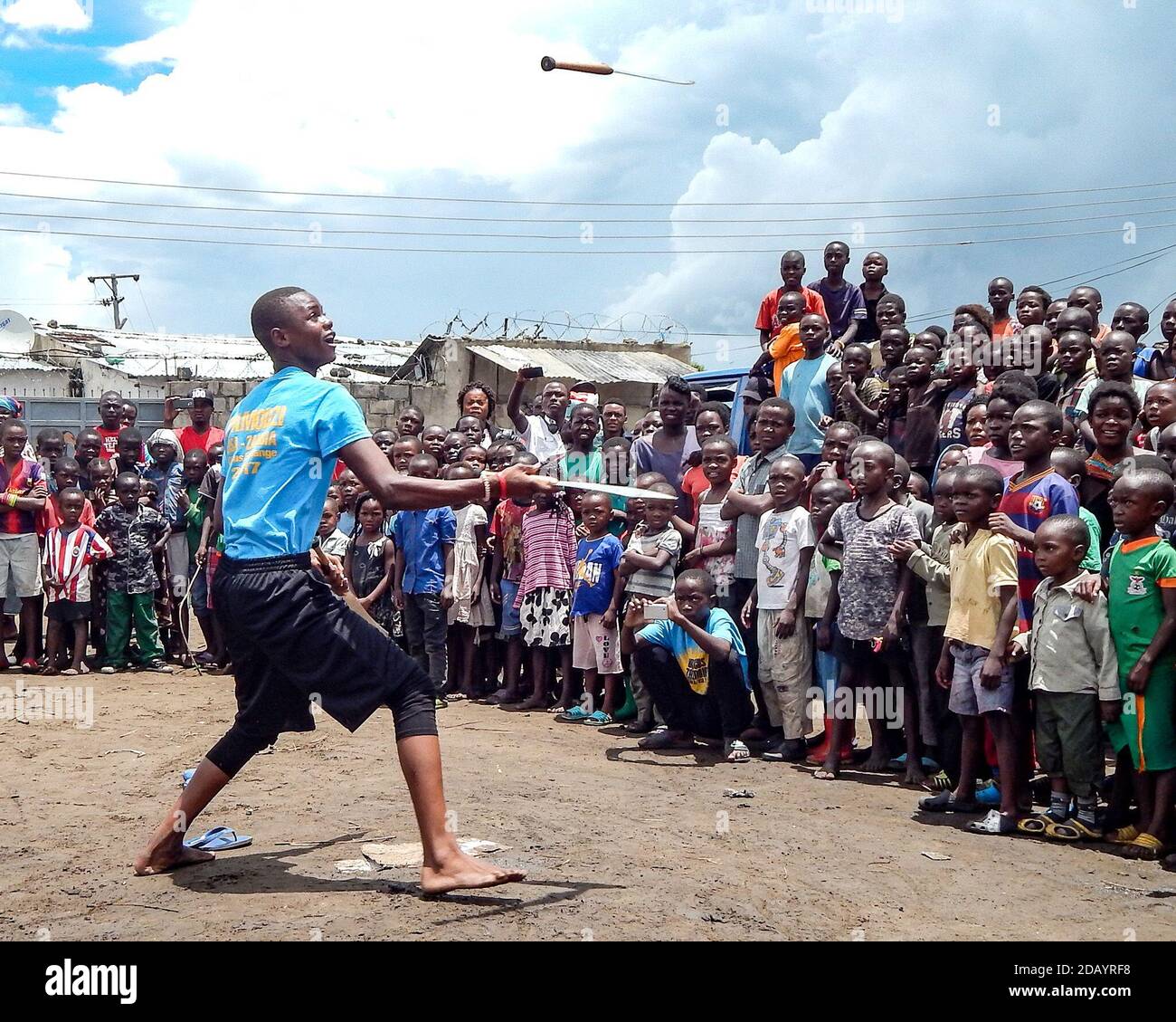 Circus Zambia member Lewis Daka juggles large knives during a show in ...