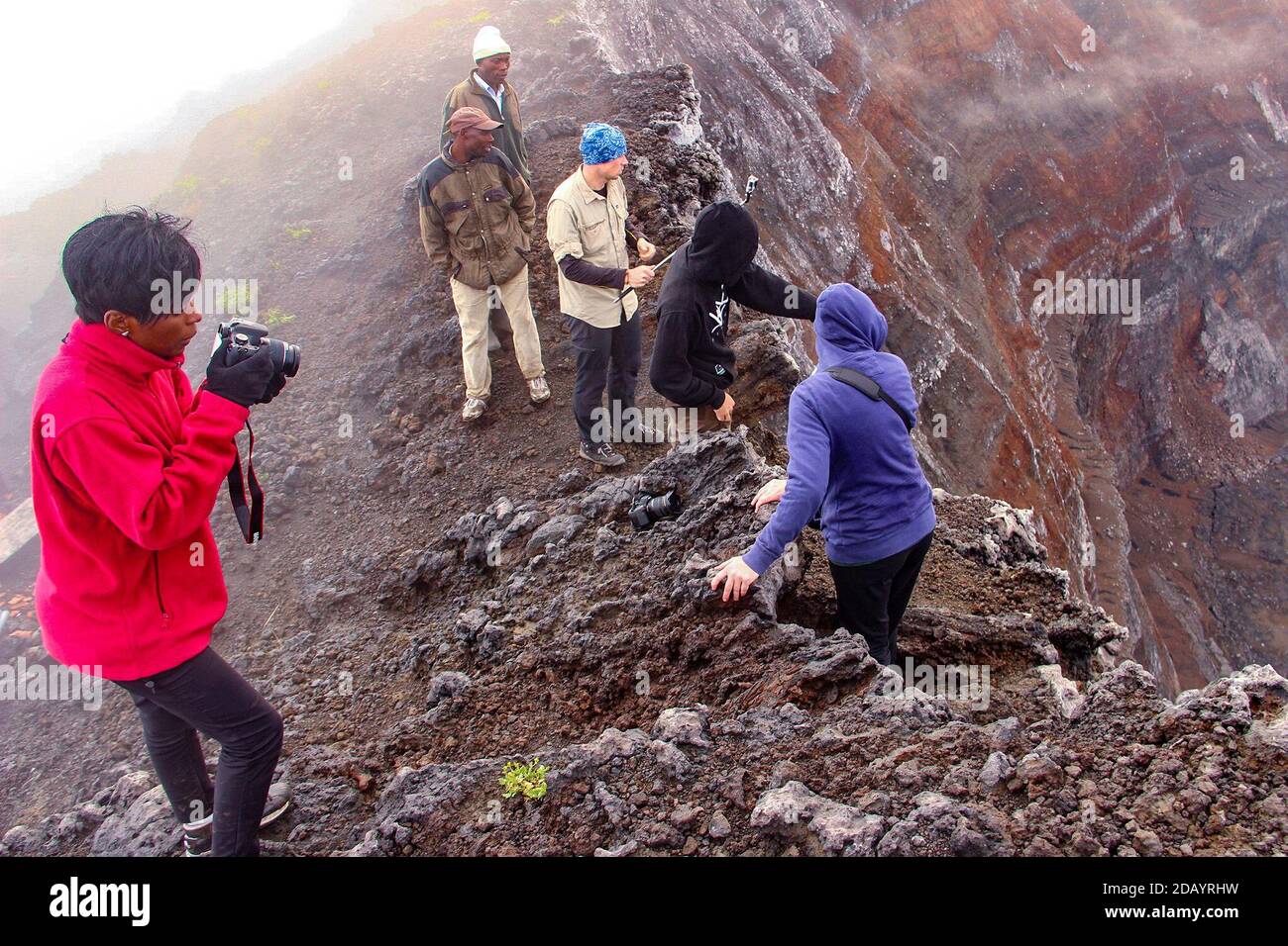 Tourists hike Mt. Nyiragongo to view the volcano in Democratic Republic ...