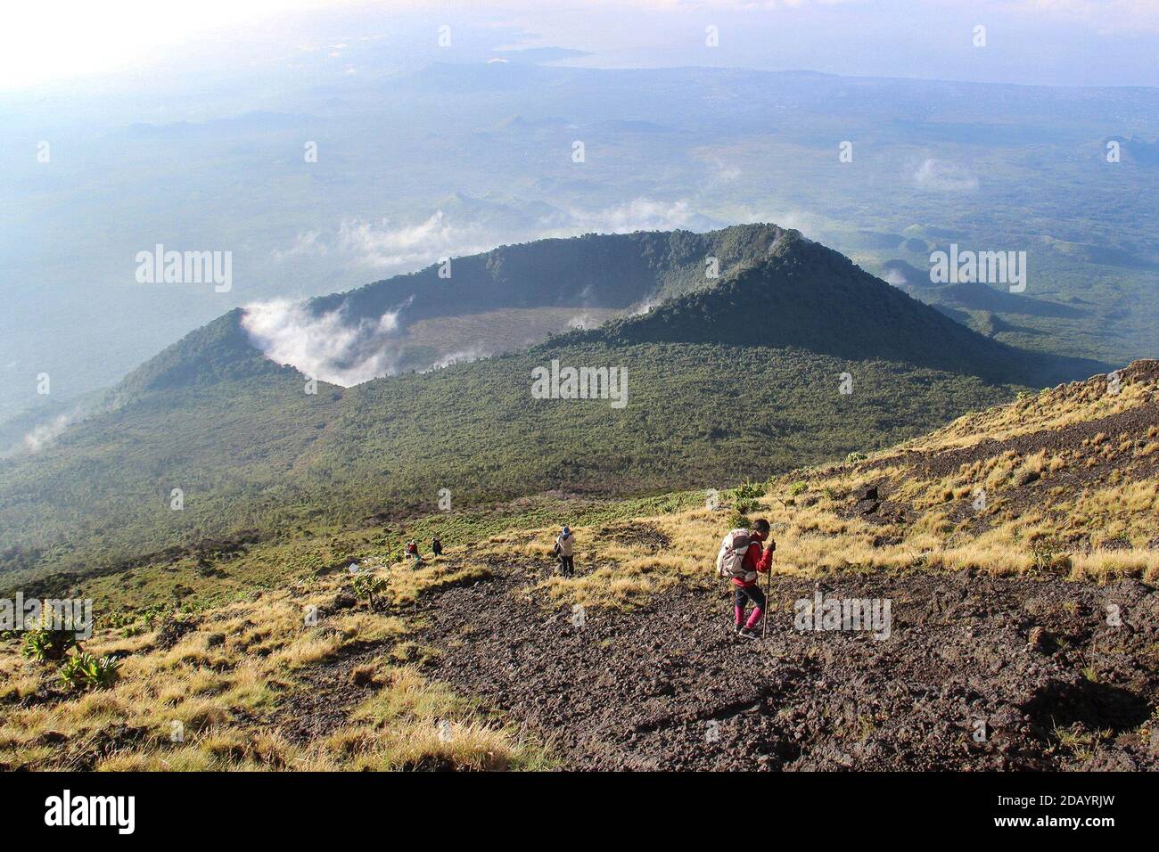 Tourists hike Mt. Nyiragongo to view the volcano in Democratic Republic ...