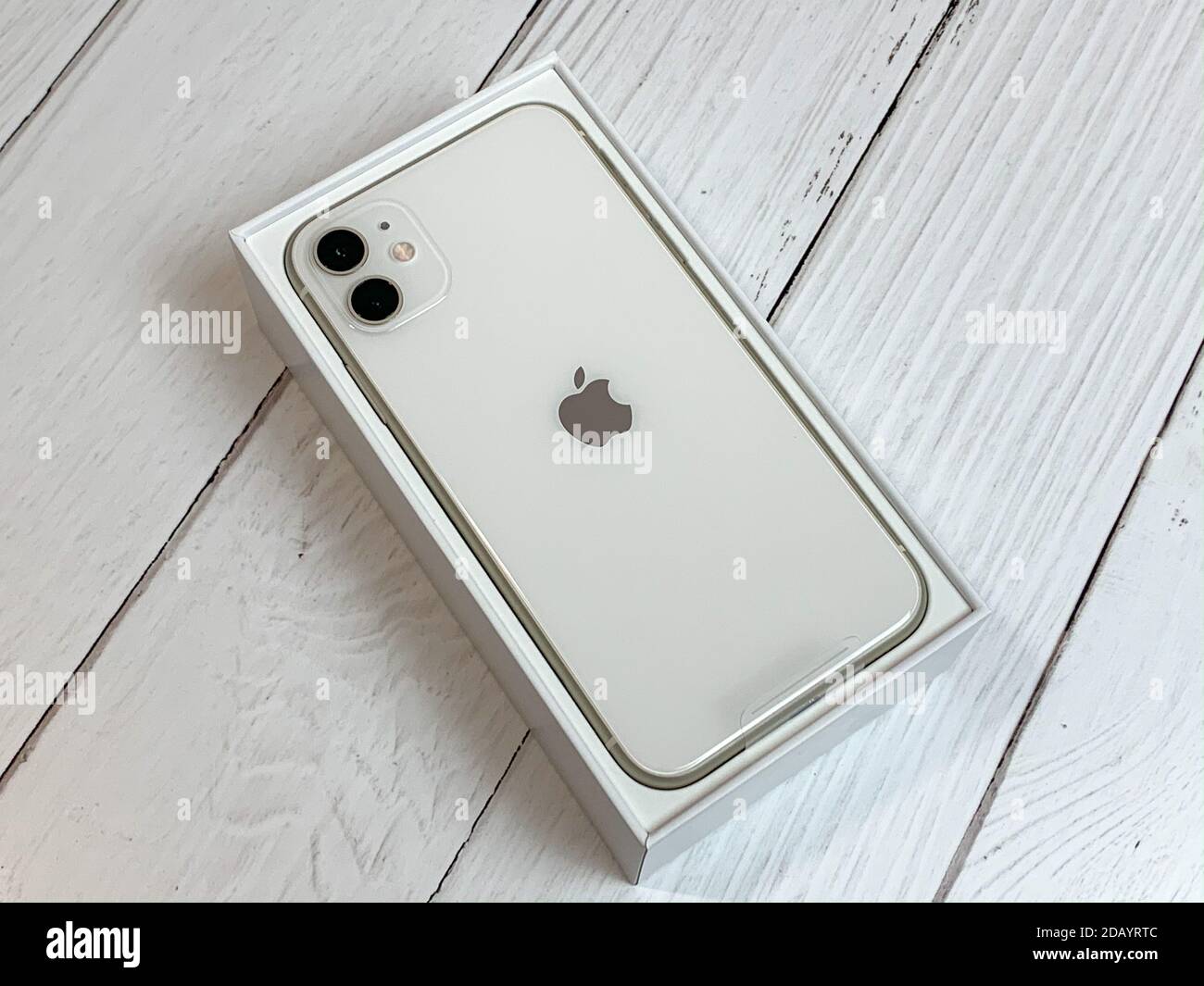 iPhone 11 in white on a desk Stock Photo - Alamy