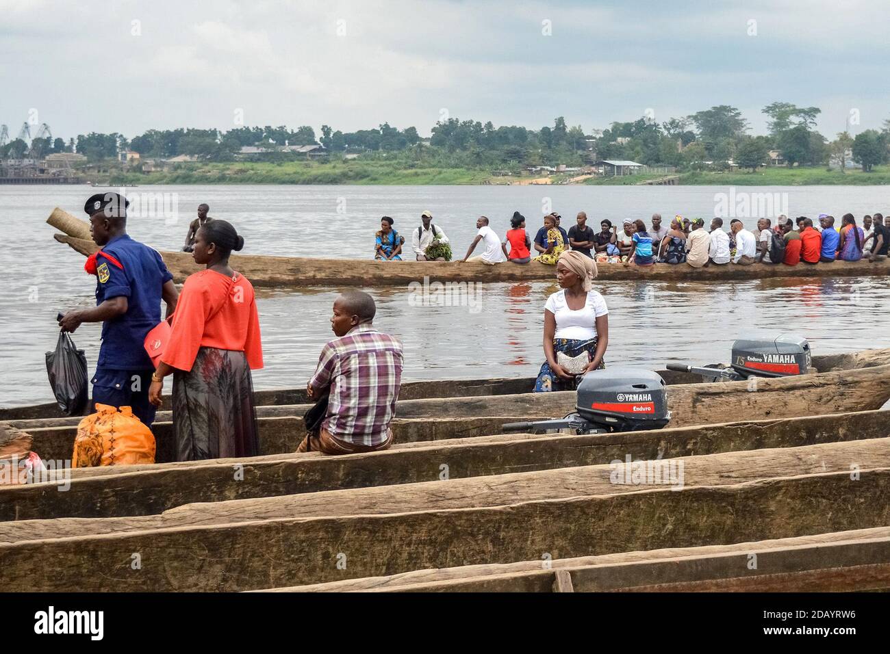 Boats carrying people travel on the Congo River in Kisangani ...