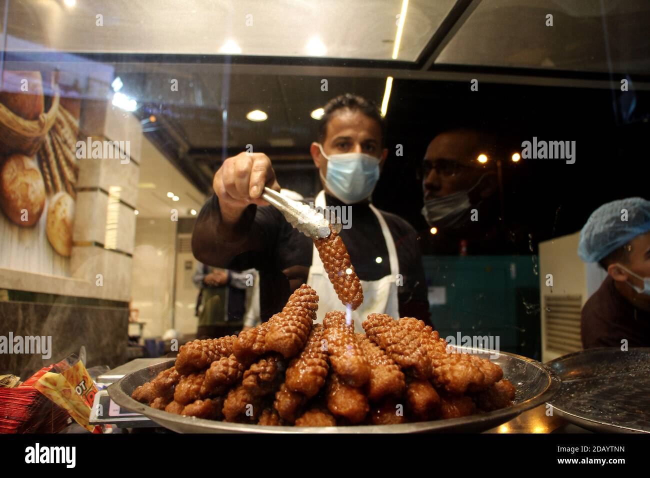 Gaza City, Gaza City. 15th Nov, 2020. A Palestinian vendor sells Luqmat ...