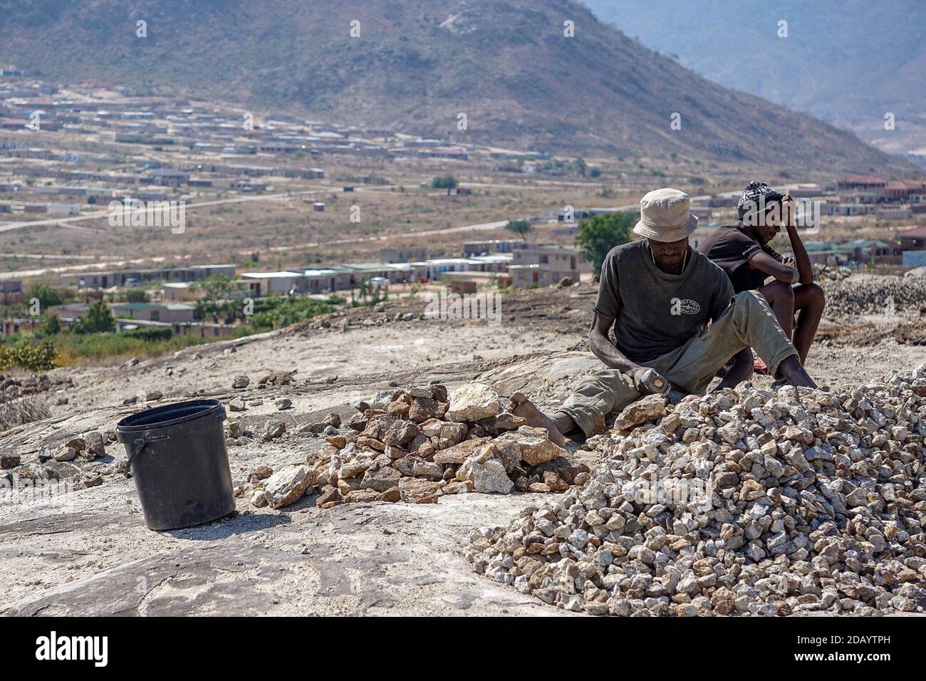 Trevor Kashiri crushes stones at a quarry in Mutare, Zimbabwe Stock ...