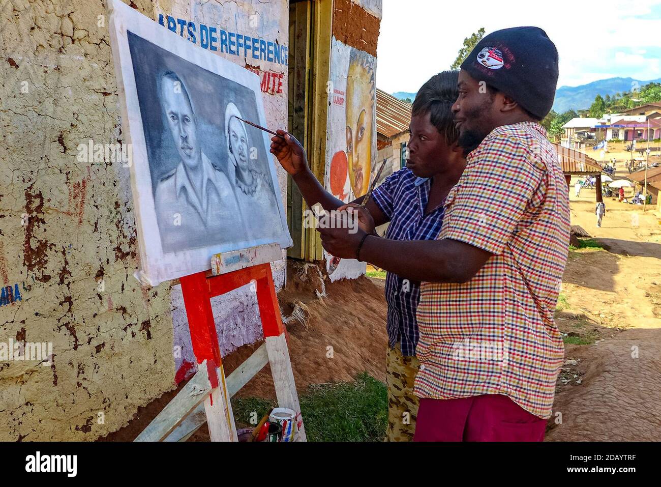 An artist gives a painting lesson in the city of Kirumba in Democratic ...