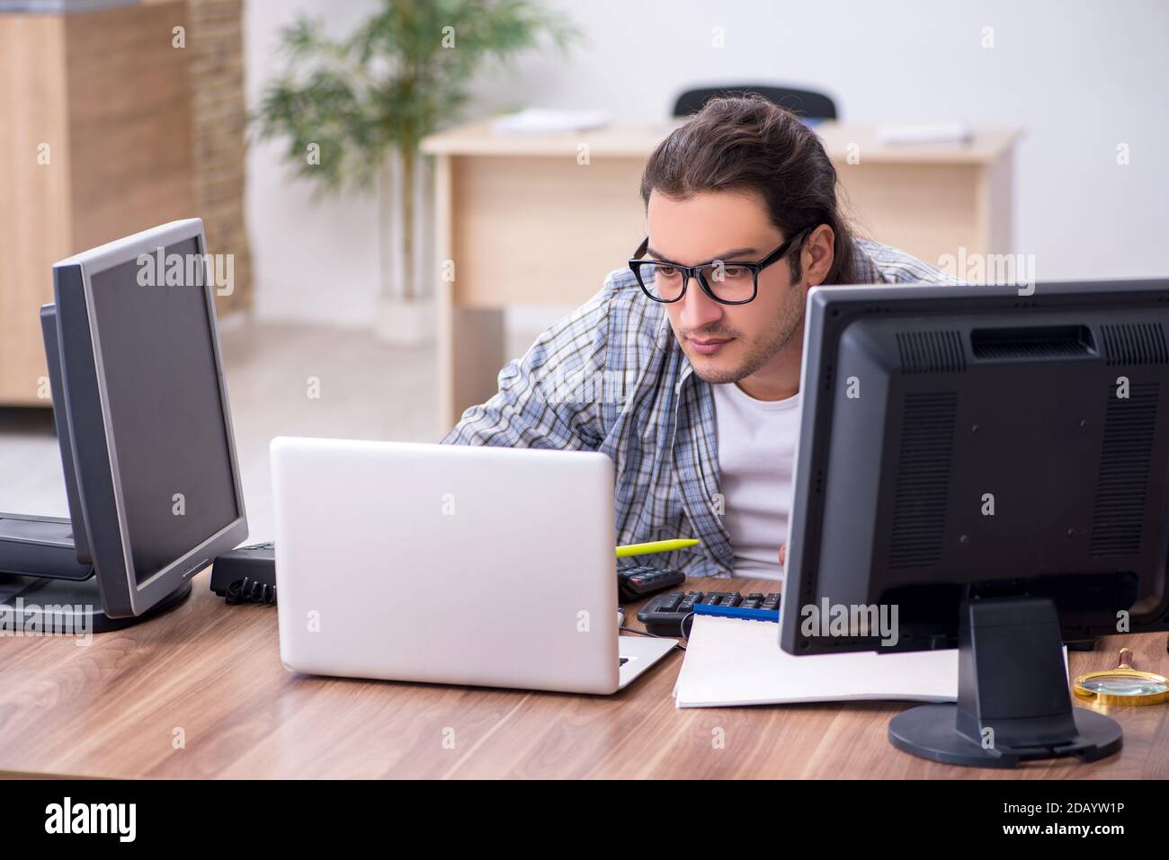 Male it specialist working in the office Stock Photo - Alamy