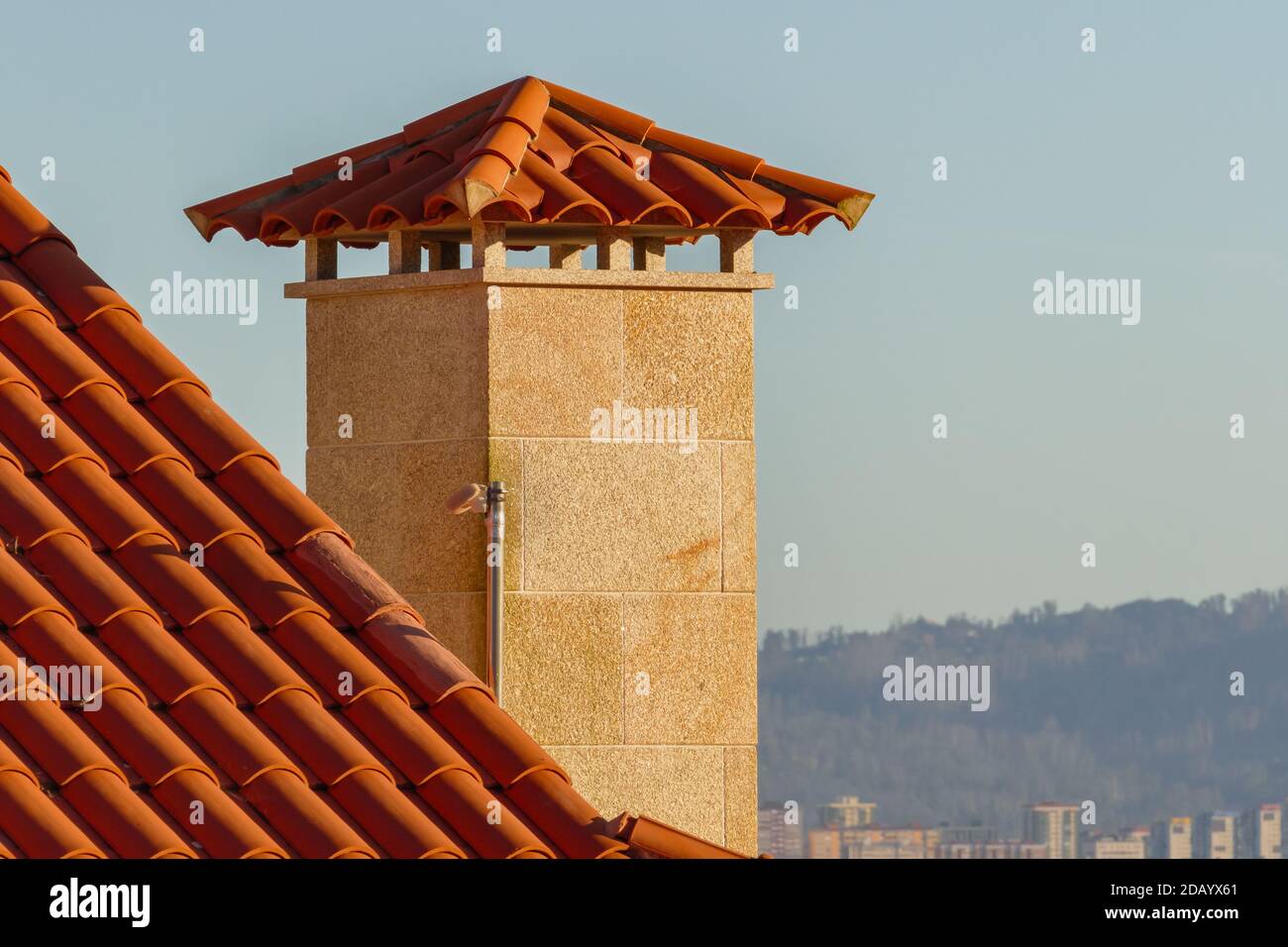 chimney with red tile roof exterior with sunlight Stock Photo - Alamy