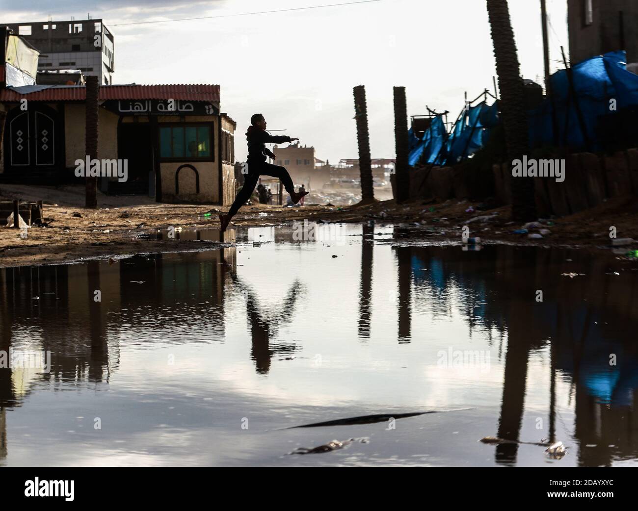 Gaza, Palestine. 15th Nov, 2020. A Palestinian boy jumps over a ...