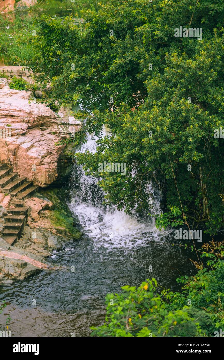 Beautiful landscape of waterfalls under trees Stock Photo - Alamy