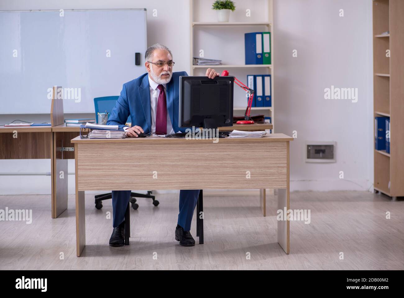 Male boss employee working in the office Stock Photo - Alamy