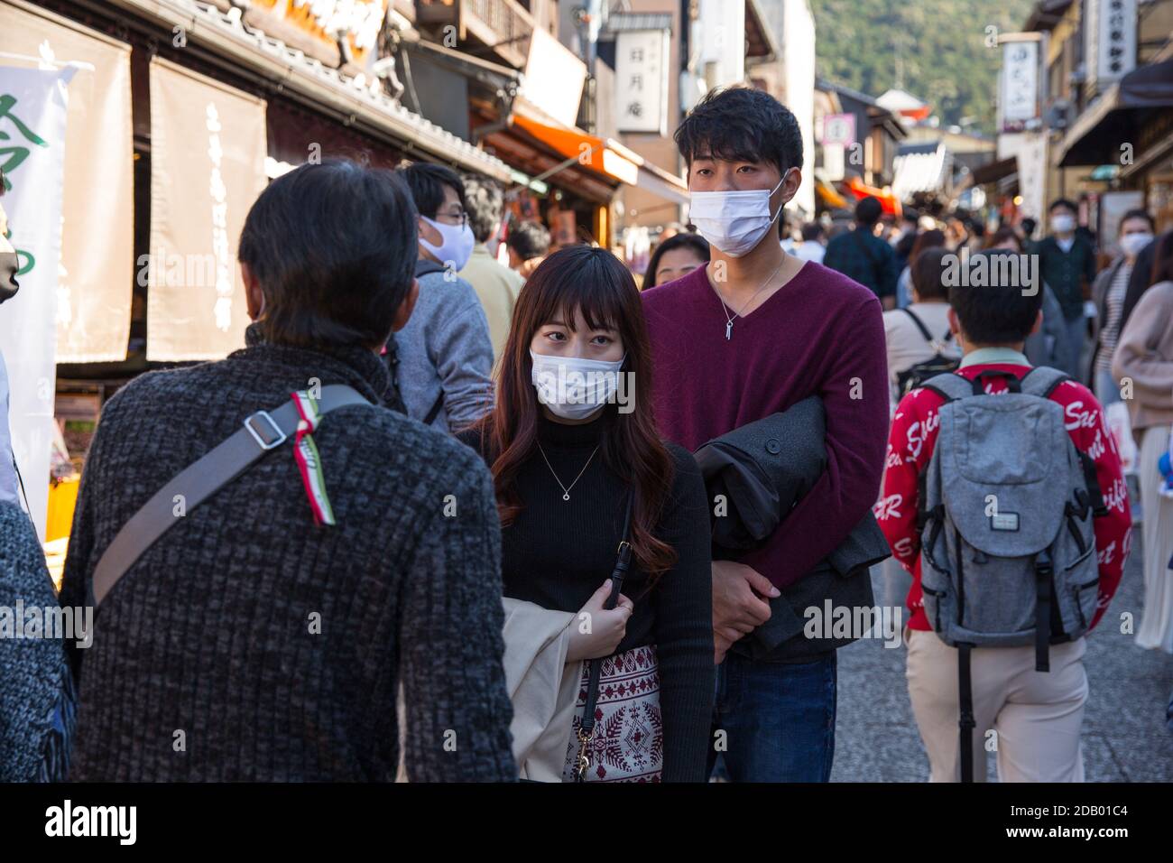 Kyoto, Japan. 14th Nov, 2020. Tourists wearing face masks as a ...