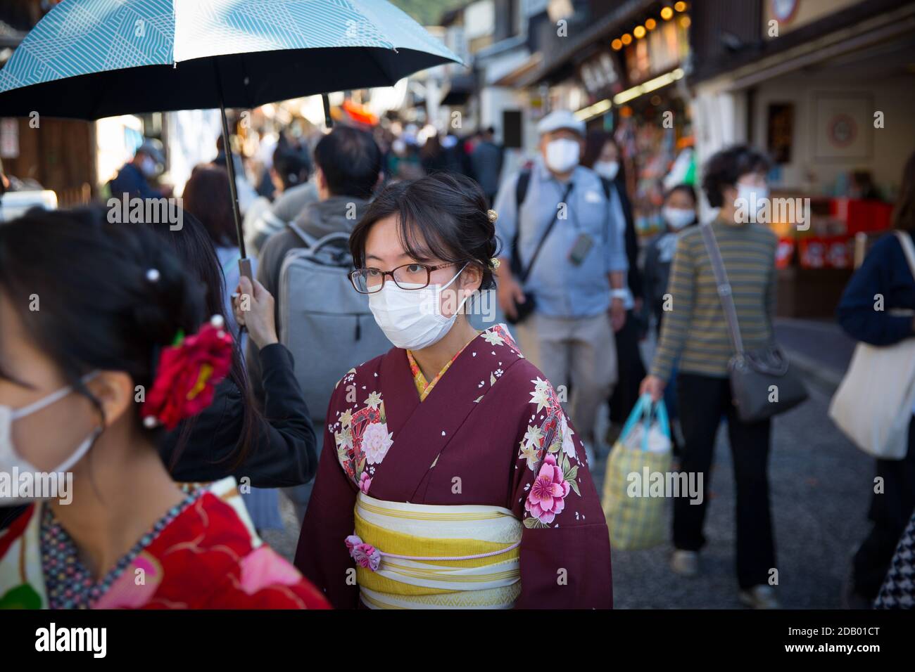 Kyoto, Japan. 14th Nov, 2020. Tourists wearing face masks as a ...