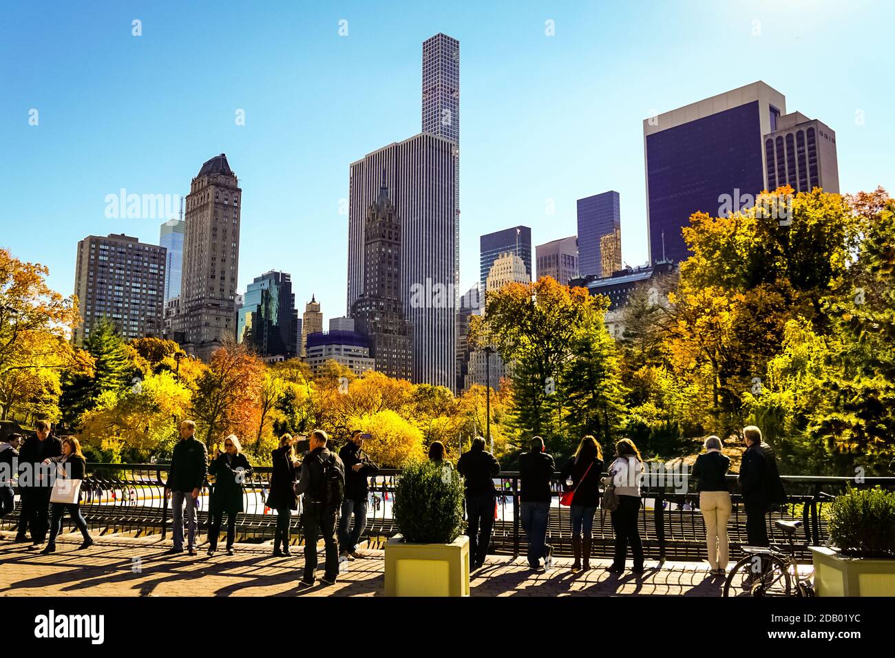 People ice skating at the Wollman Rink in Central Park on a sunny ...