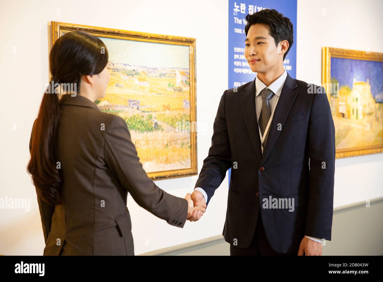 People with guide at exhibition in art gallery 019 Stock Photo - Alamy