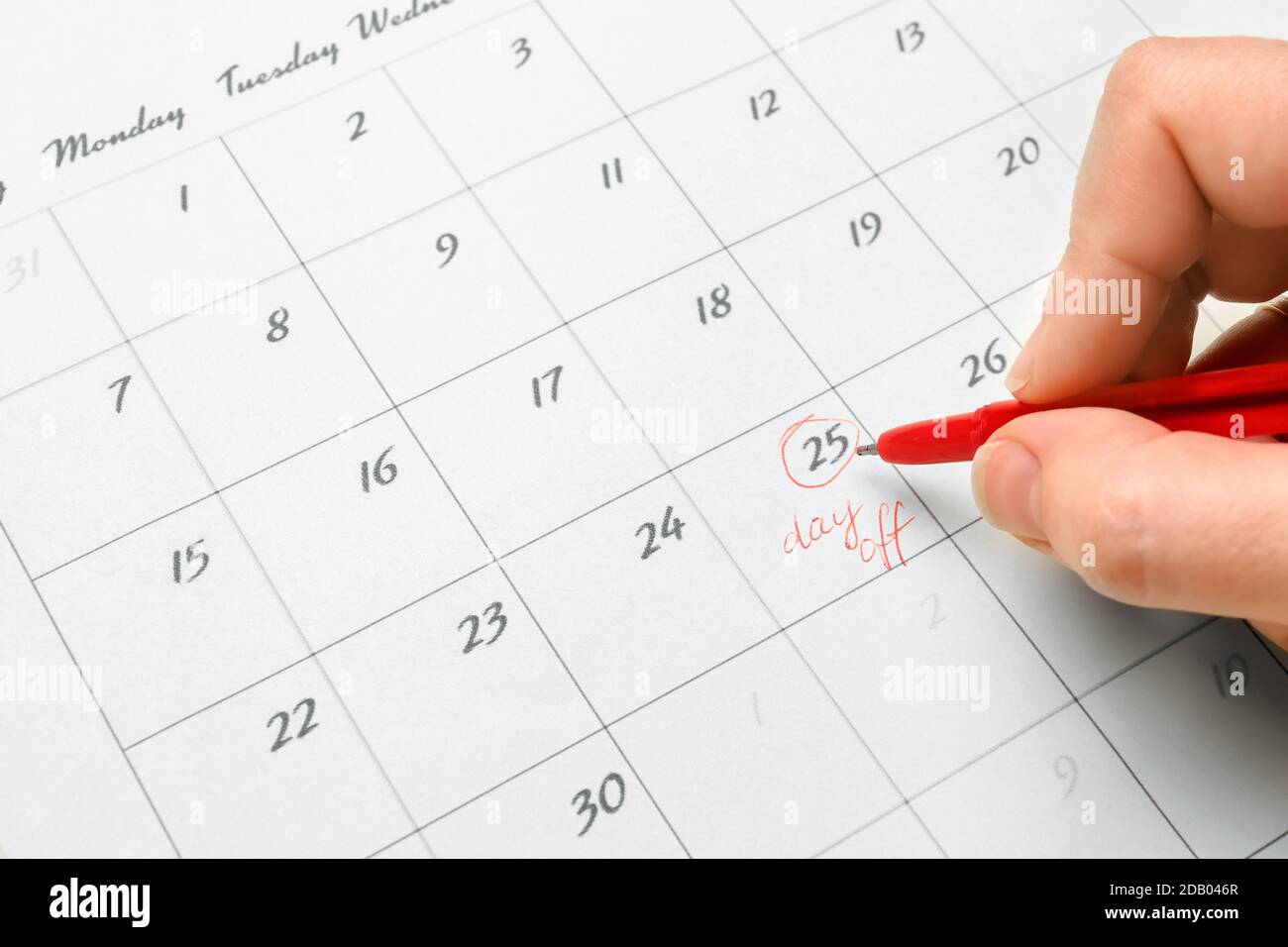 Woman marking day off in calendar, closeup Stock Photo - Alamy