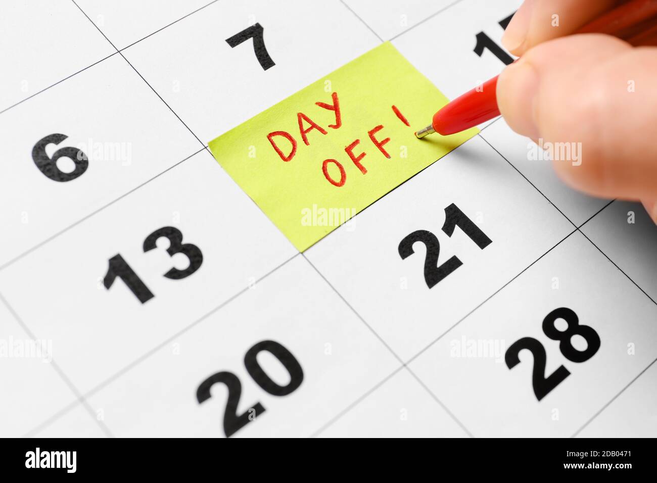 Woman marking day off in calendar, closeup Stock Photo - Alamy