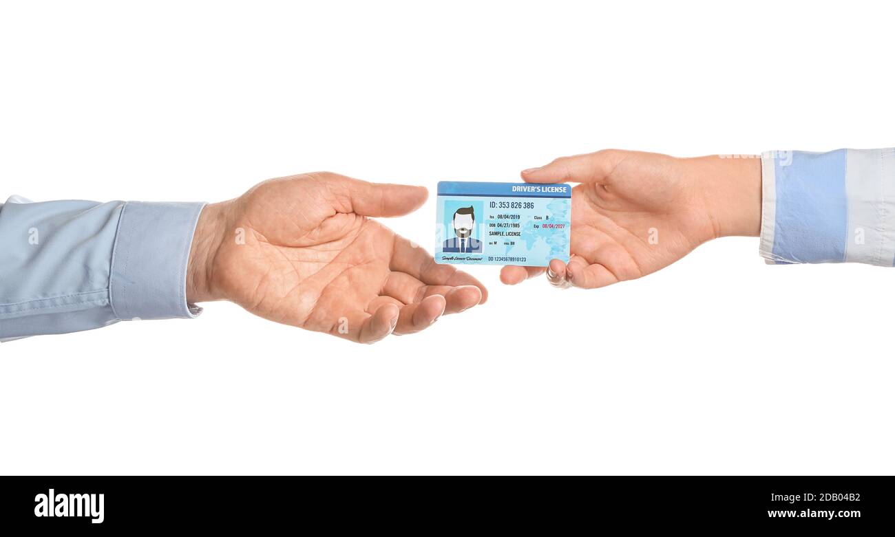 Male and female hands with driving license on white background Stock ...