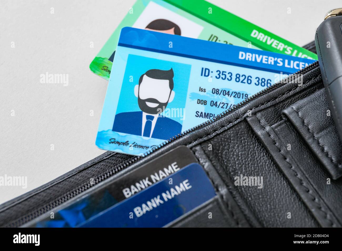 Wallet with driving licenses on white background, closeup Stock Photo ...