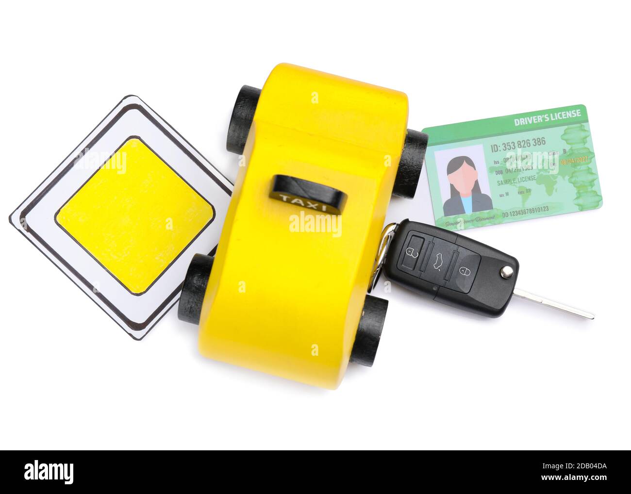 Driving license with car, key and traffic sign on white background ...