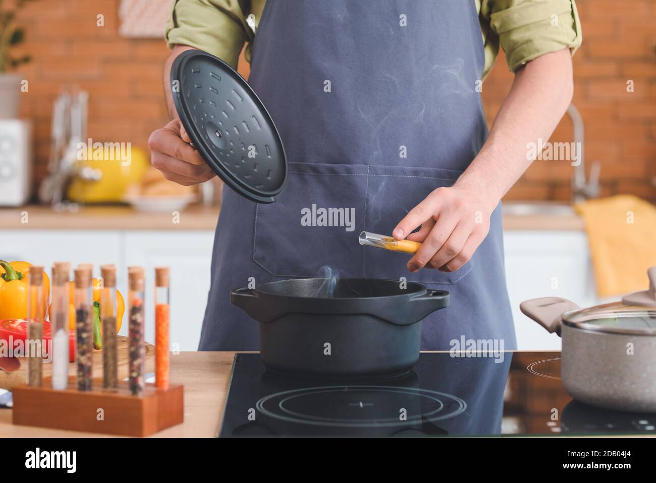 Induction cooking male hi-res stock photography and images - Alamy