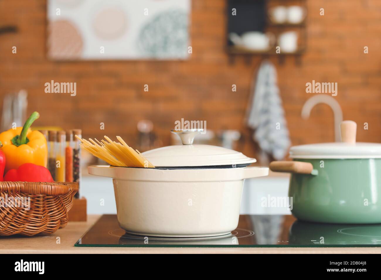 Cooking pots on stove in kitchen Stock Photo - Alamy