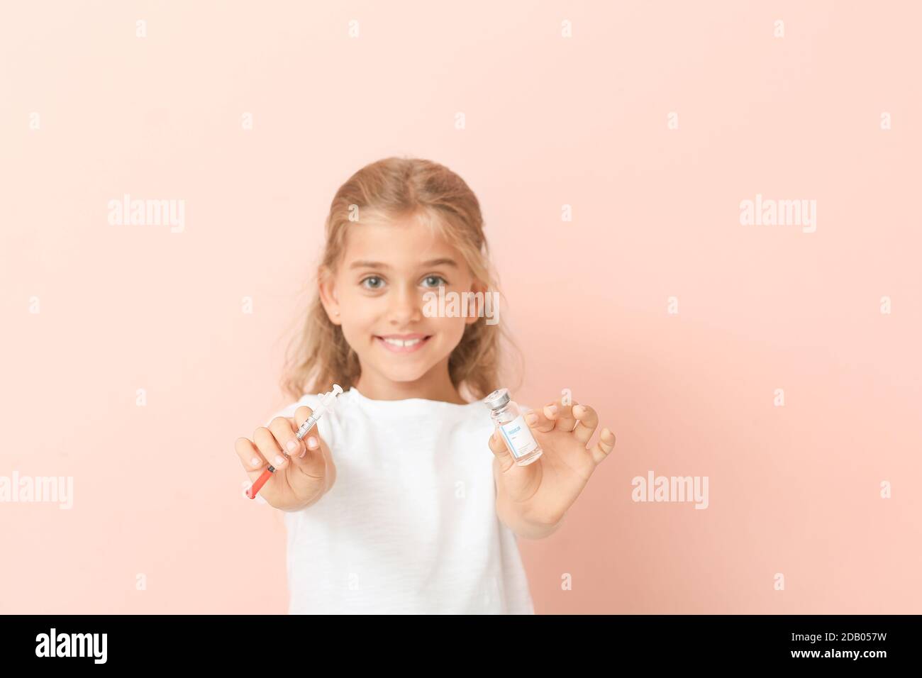 Little diabetic girl with insulin and syringe on color background Stock ...