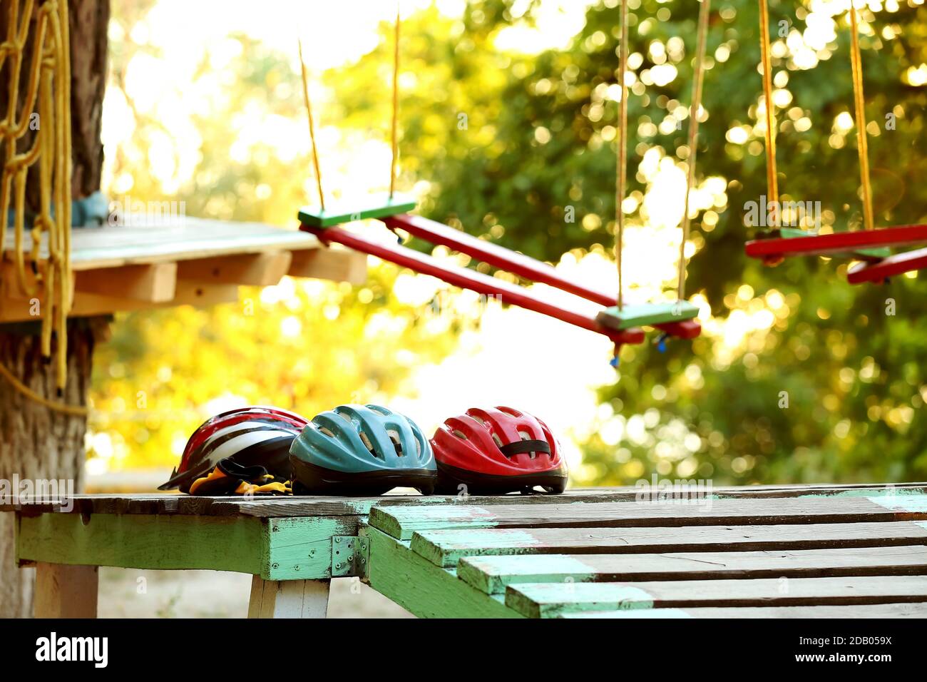 Safety helmets in adventure park Stock Photo - Alamy
