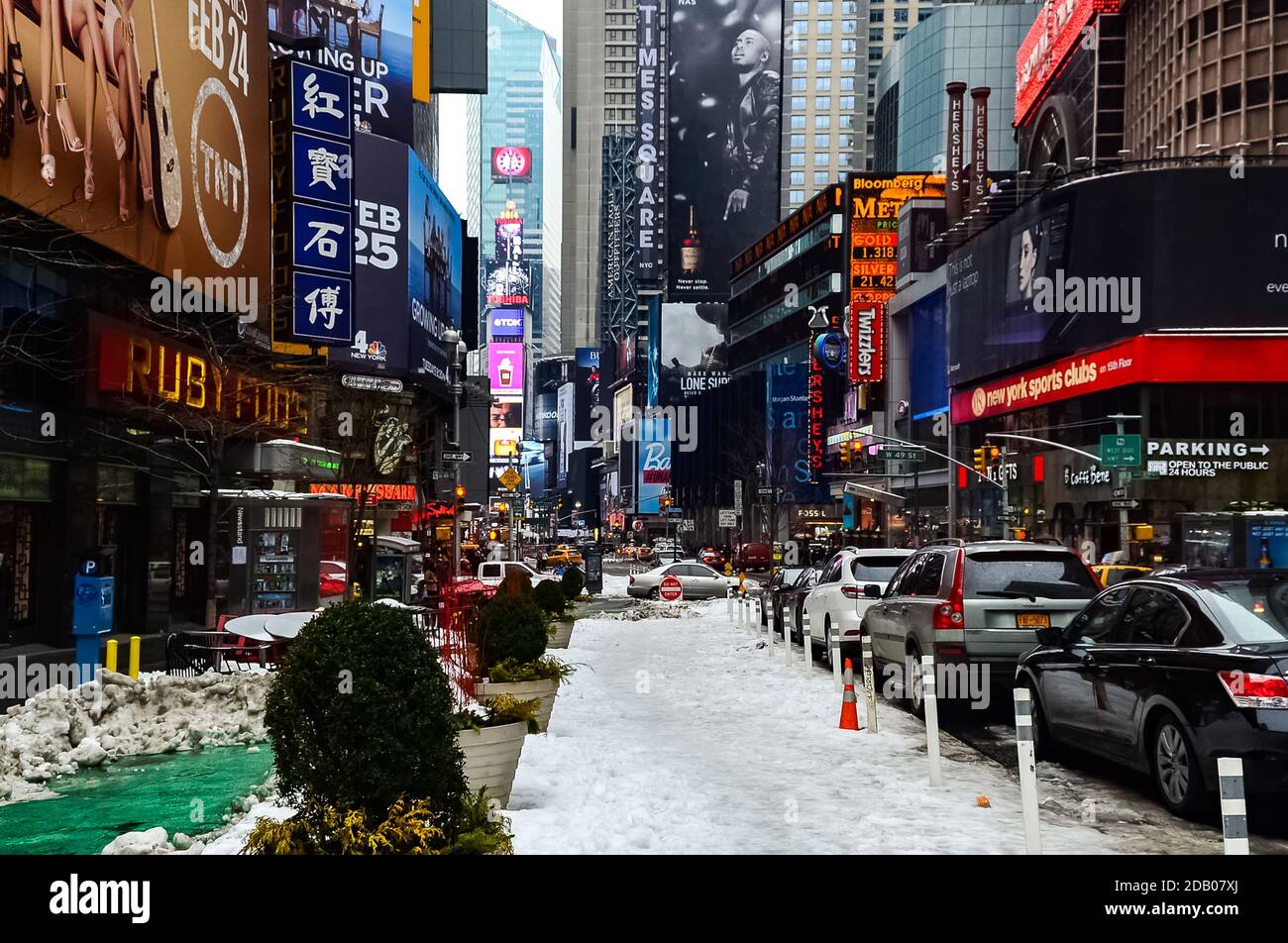 Times Square in winter blizzard snowstorm with people commuting and ...