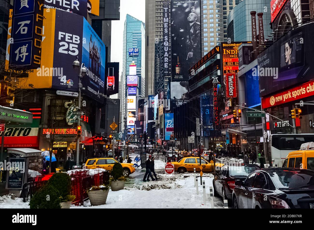 Times Square in winter blizzard snowstorm with people commuting and ...