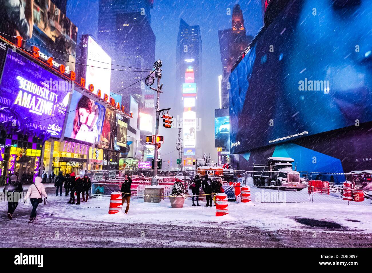 Times Square in winter blizzard snowstorm with people commuting and ...