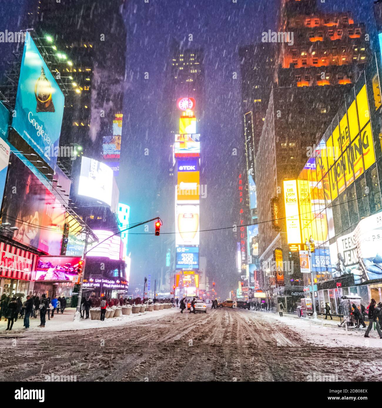 Times Square in winter blizzard snowstorm with people commuting and ...