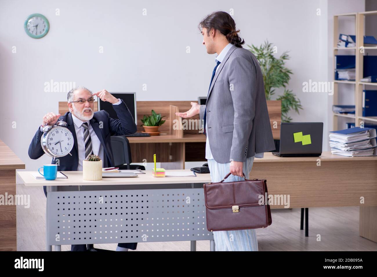 Young employee being late for work Stock Photo - Alamy