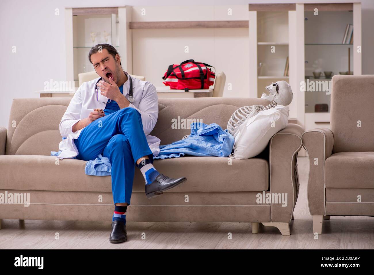 Male paramedic visiting skeleton patient Stock Photo - Alamy