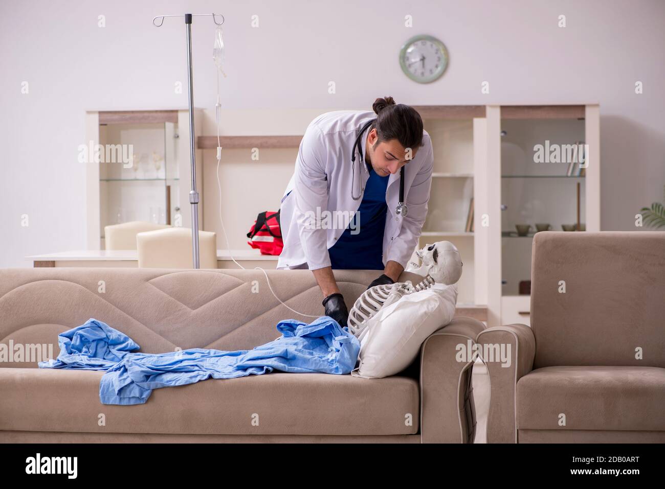 Male paramedic visiting skeleton patient Stock Photo - Alamy