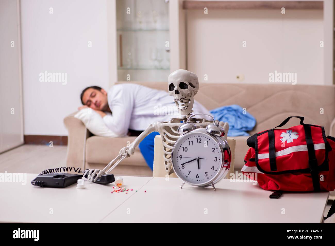 Male paramedic visiting skeleton patient Stock Photo - Alamy