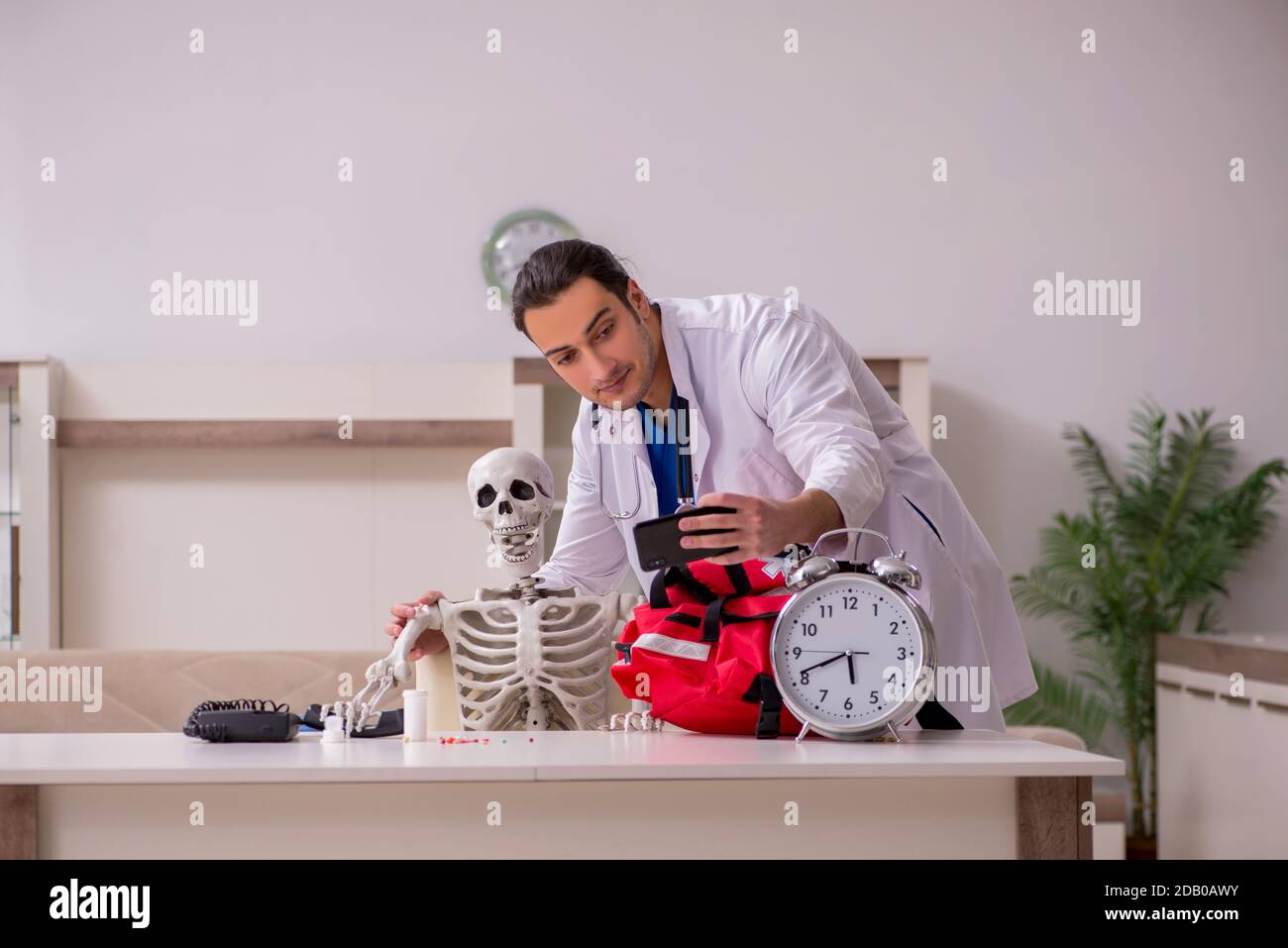 Male paramedic visiting skeleton patient Stock Photo - Alamy