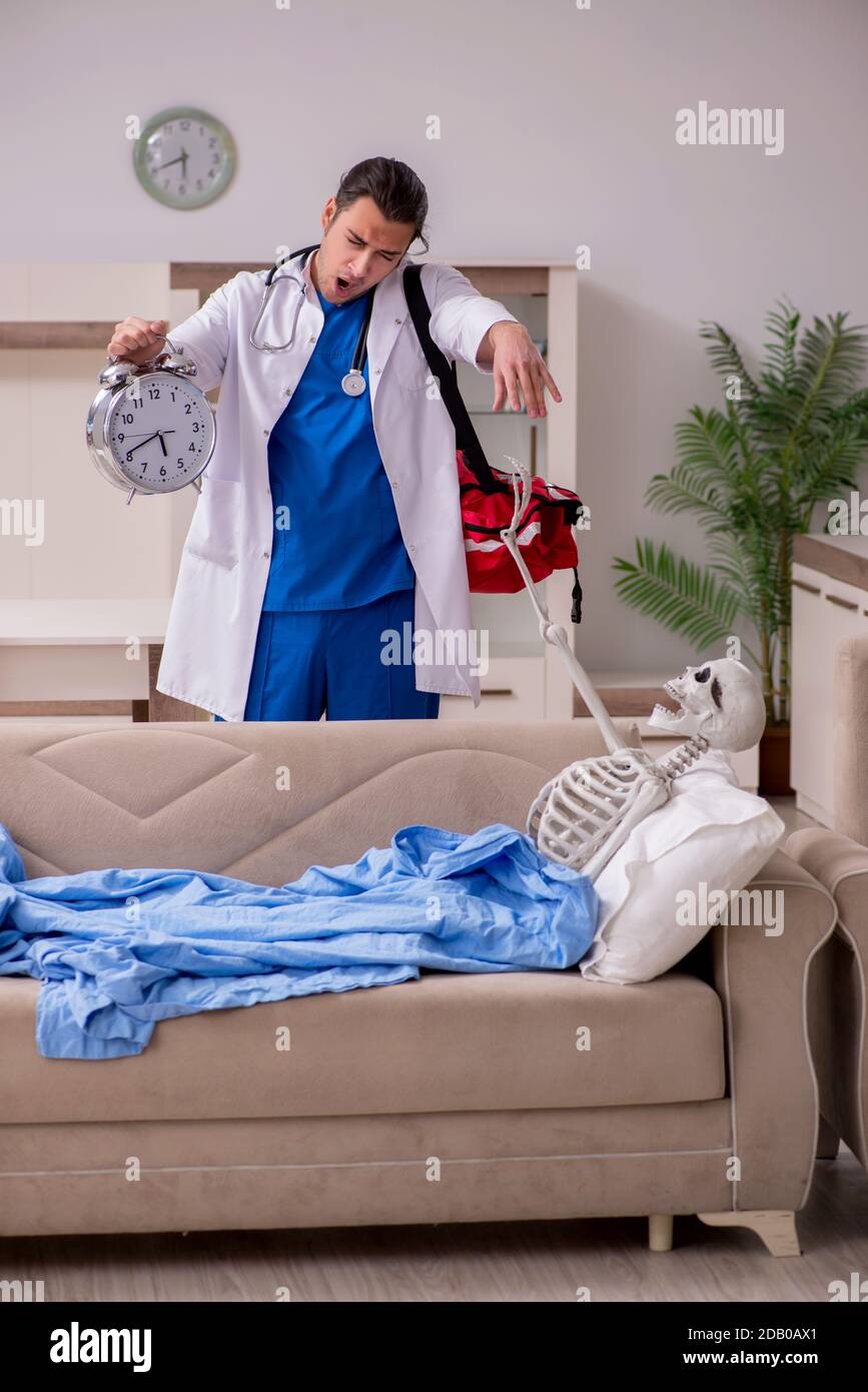 Male paramedic visiting skeleton patient Stock Photo - Alamy