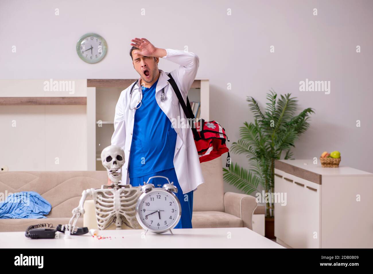 Male paramedic visiting skeleton patient Stock Photo - Alamy
